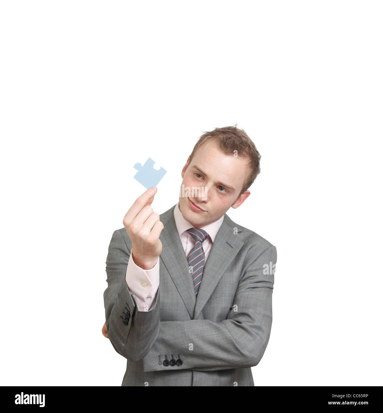 A business man solving a puzzle Stock Photo - Alamy