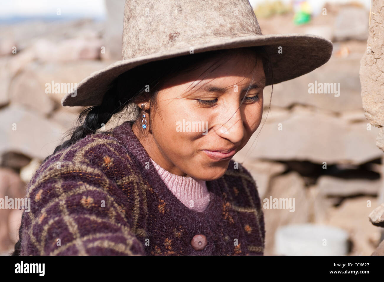 Peruvian Quechua or Quecha woman in traditional dress hat, Atuncolla ...
