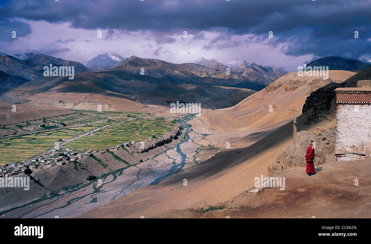 Monk praying beside Ruins of Xiangbolin Monastery, Ngari, Tibet, China ...