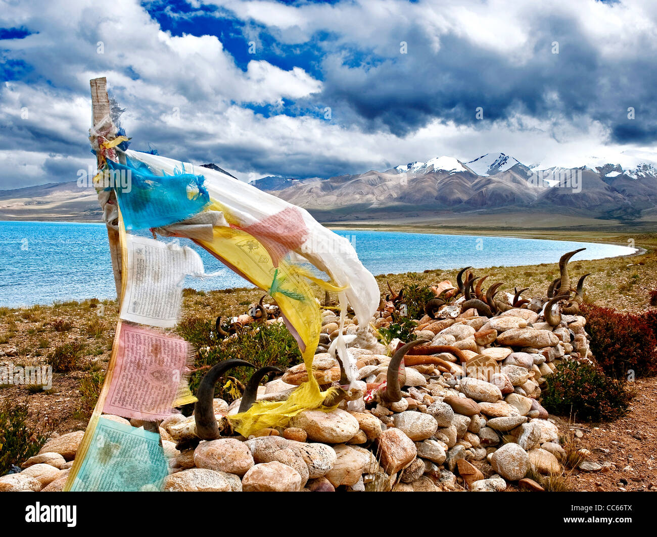 Mani pile flying prayer flags hi-res stock photography and images - Alamy