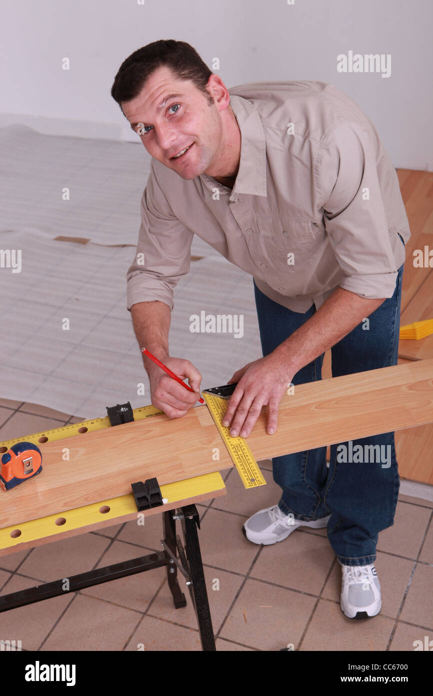 Male carpenter lay wooden laminate hi-res stock photography and images ...