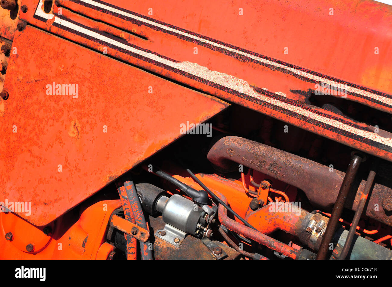 Closeup of rusty tractor engine with faded red paint Stock Photo - Alamy