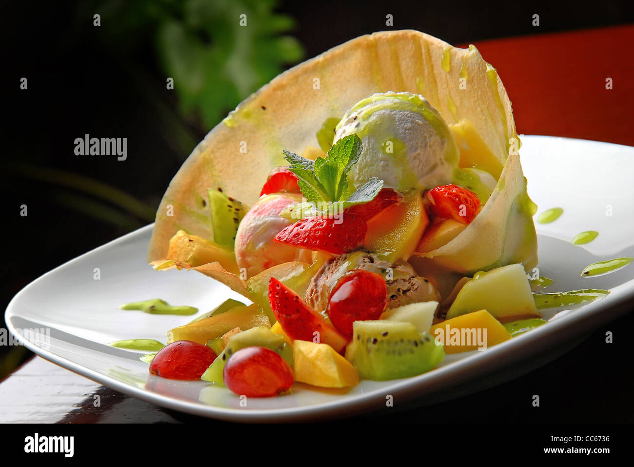 Fruit ice cream with fresh fruits and berries Stock Photo - Alamy