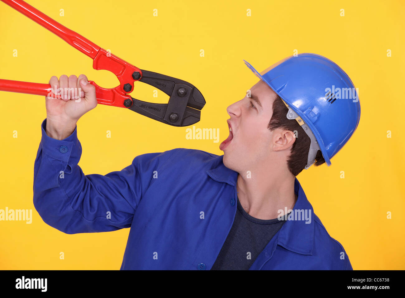 Man holding bolt cutters Stock Photo - Alamy