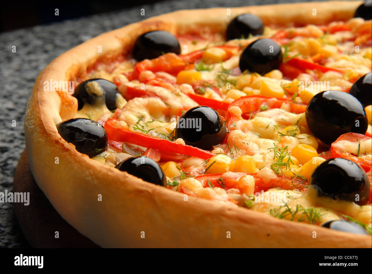 Round Italian pizza with salami, olives, capsicum and cheese Stock ...