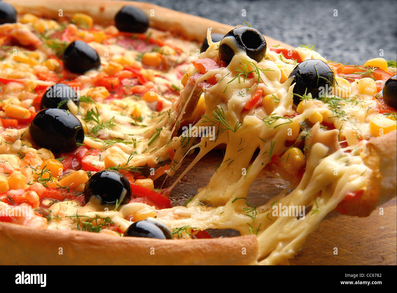 Round Italian pizza with salami, olives, capsicum and cheese Stock ...