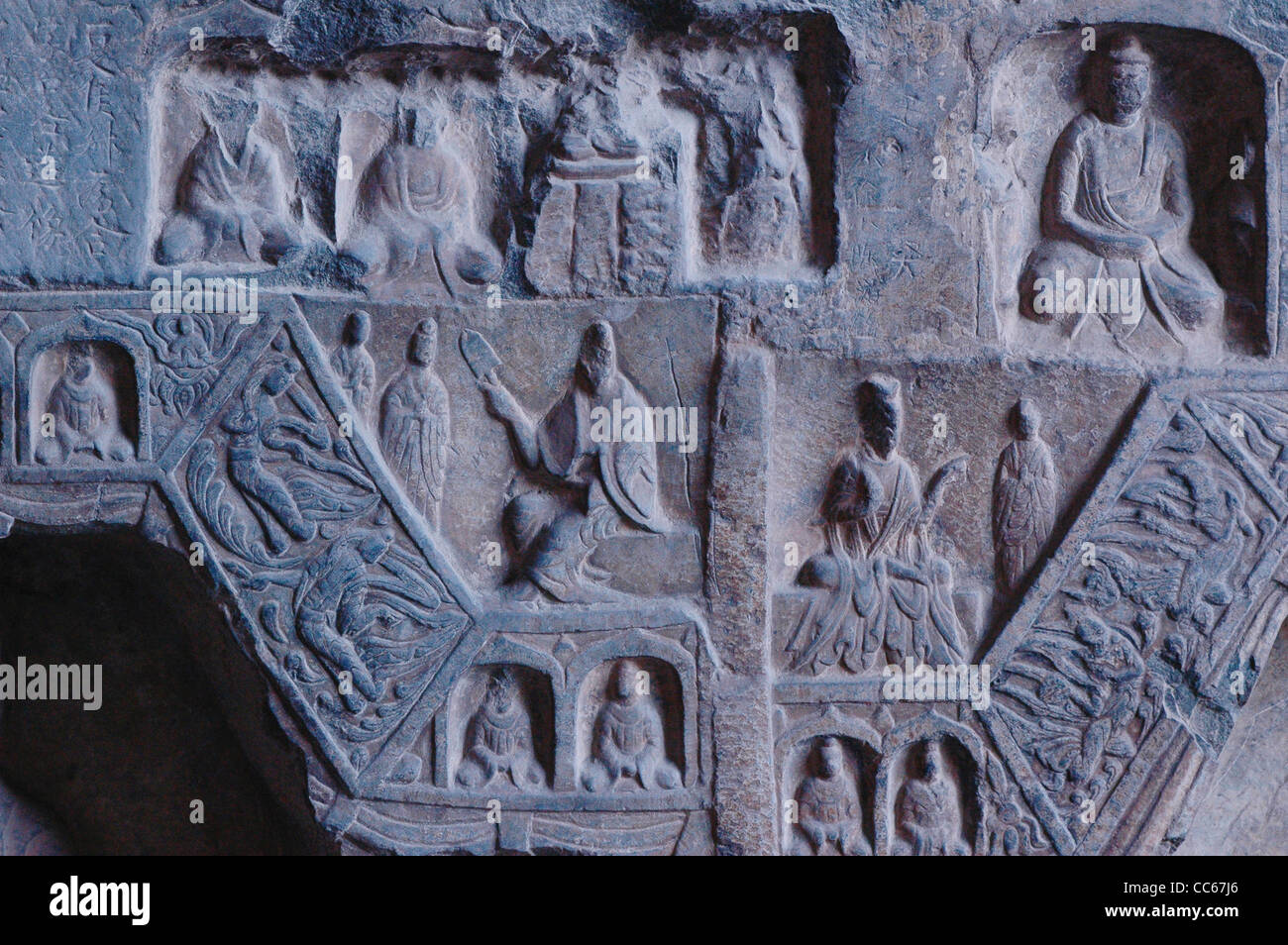 Stone wall carved with Buddha, Longmen Grottoes, Luoyang, Henan , China ...