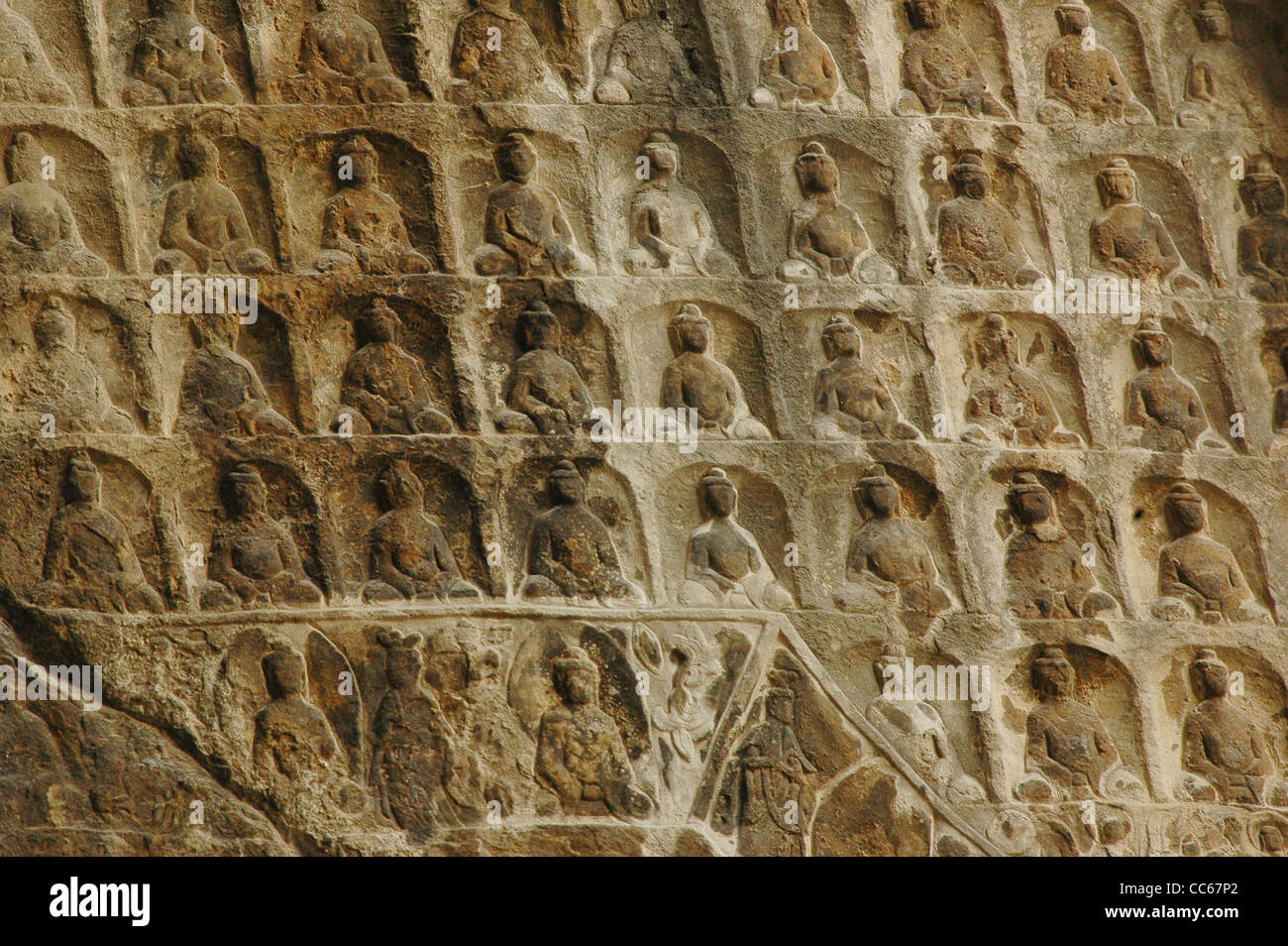 Stone wall carved with Buddha, Longmen Grottoes, Luoyang, Henan , China ...