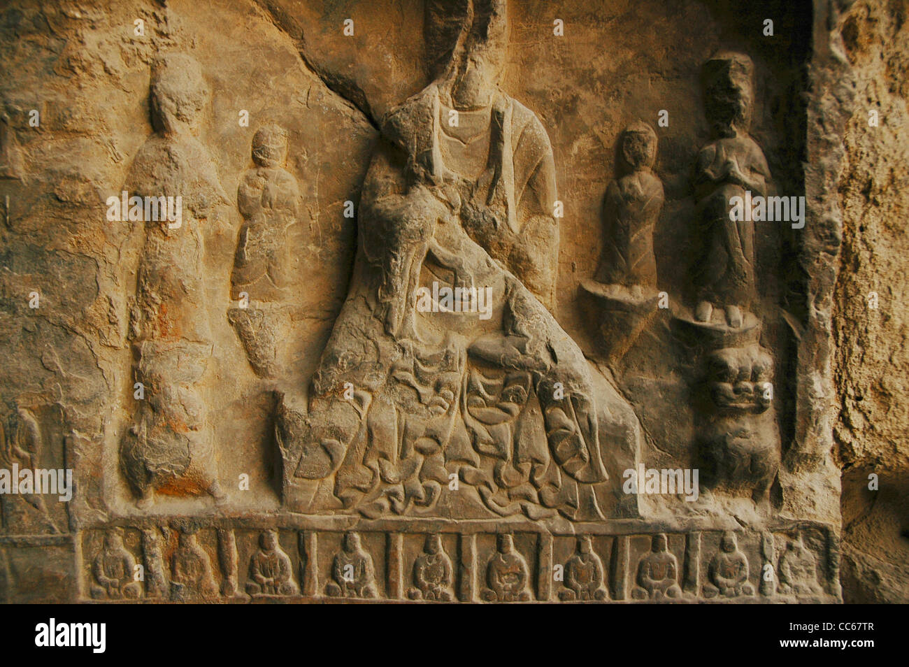 Stone wall carved with Buddha, Longmen Grottoes, Luoyang, Henan , China ...