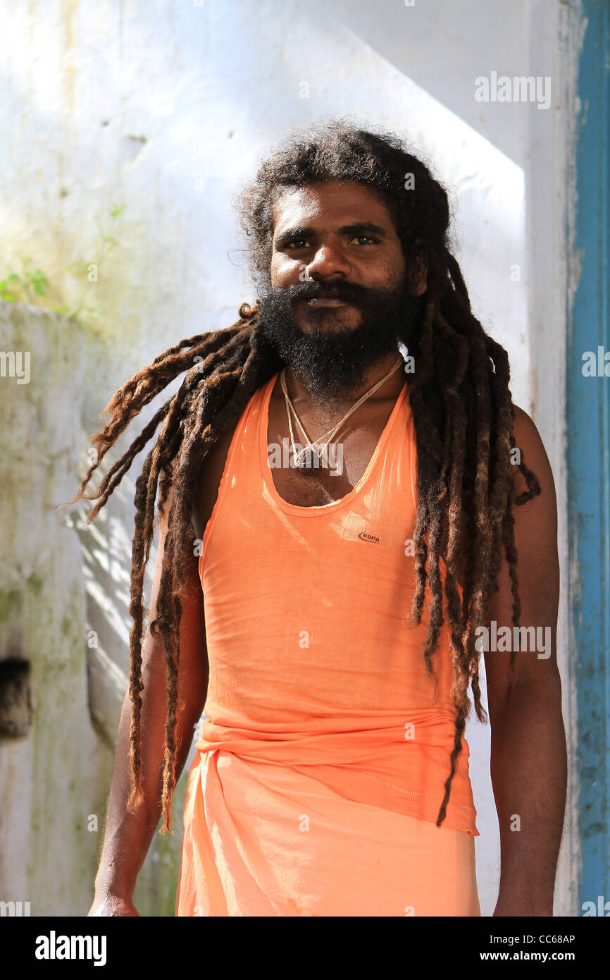 Indian priest with dreadlocks smiling in orange. Rajasthan Stock Photo ...