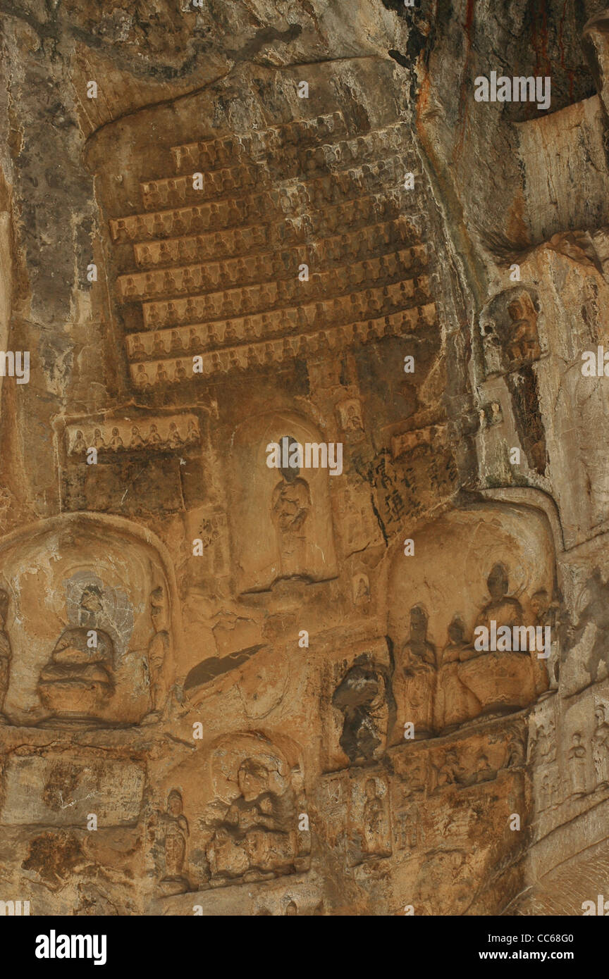 Stone wall carved with Buddha, Longmen Grottoes, Luoyang, Henan , China ...