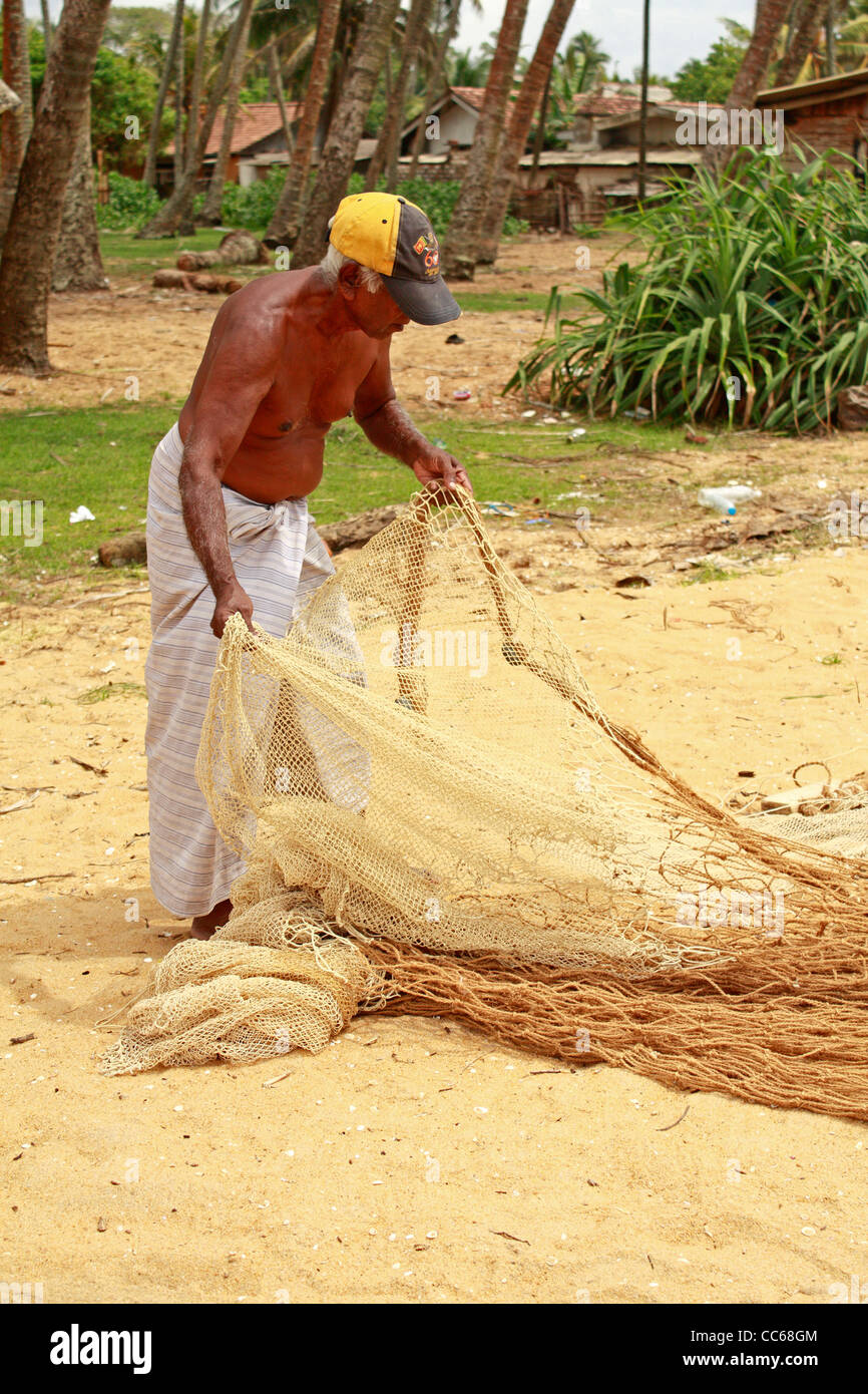 Fisherman carrying fishing net hi-res stock photography and images - Alamy