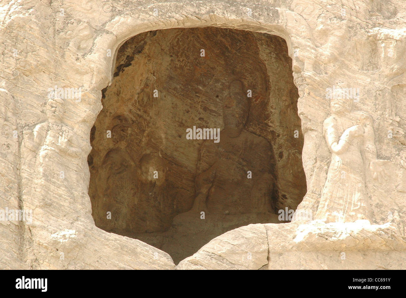 Buddha statue in a cave, Longmen Grottoes, Luoyang, Henan , China Stock ...