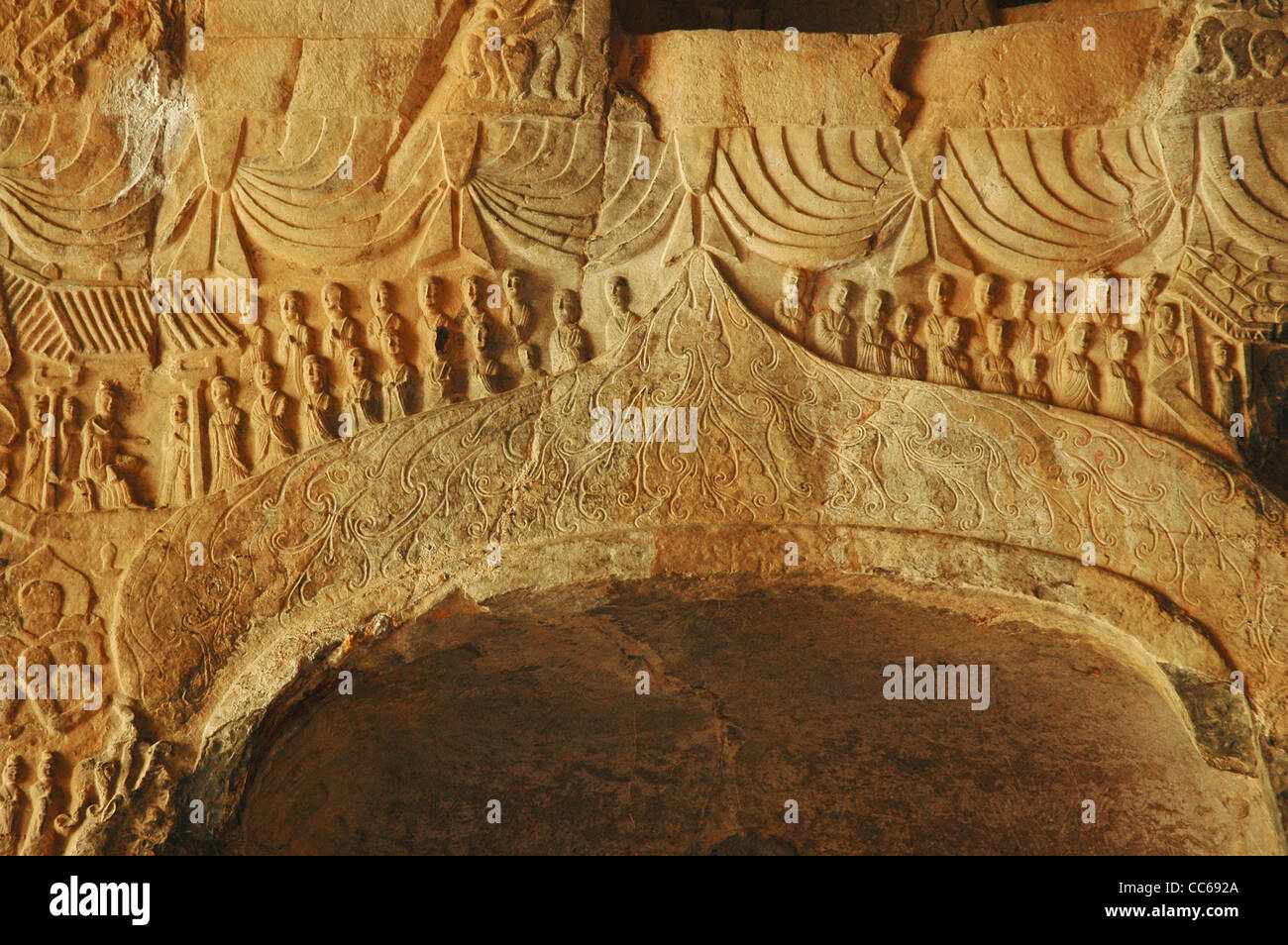 Stone wall carved with patterns, Longmen Grottoes, Luoyang, Henan ...