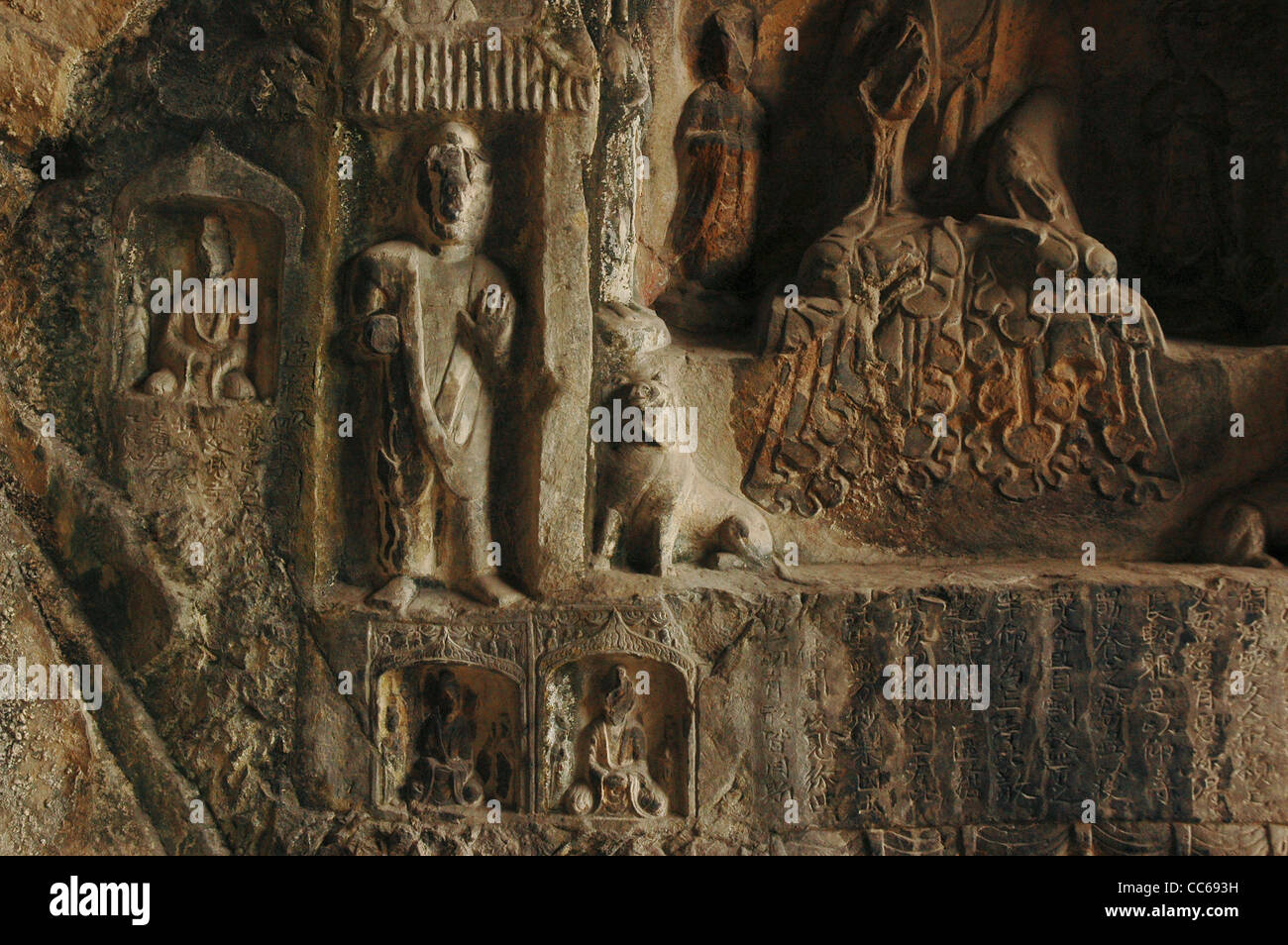 Stone wall carved with Buddha, Longmen Grottoes, Luoyang, Henan , China ...