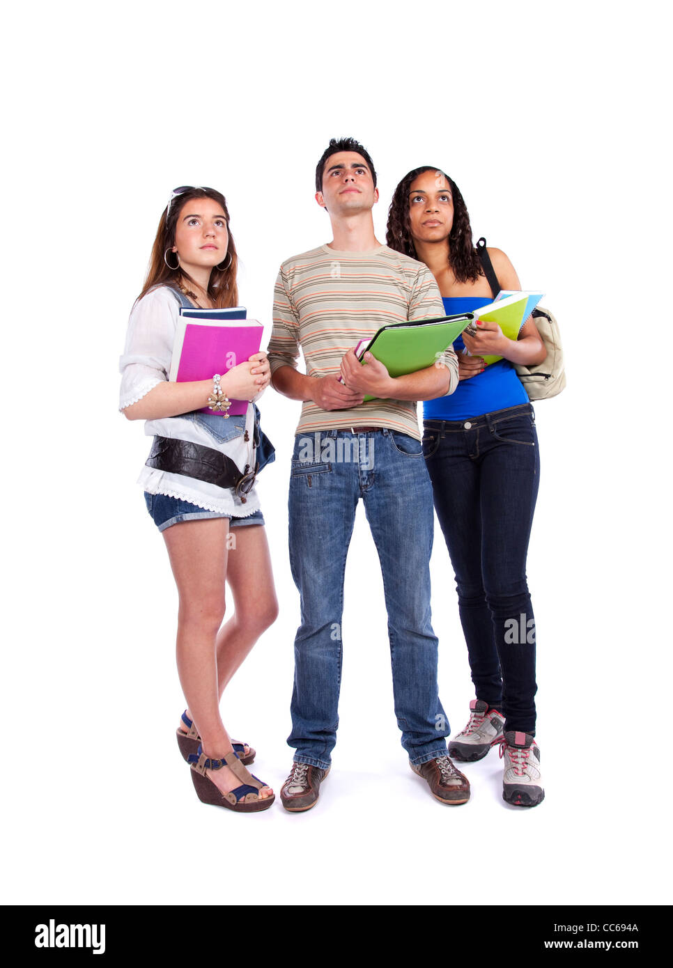 Three happy students holding books (isolated on white Stock Photo - Alamy