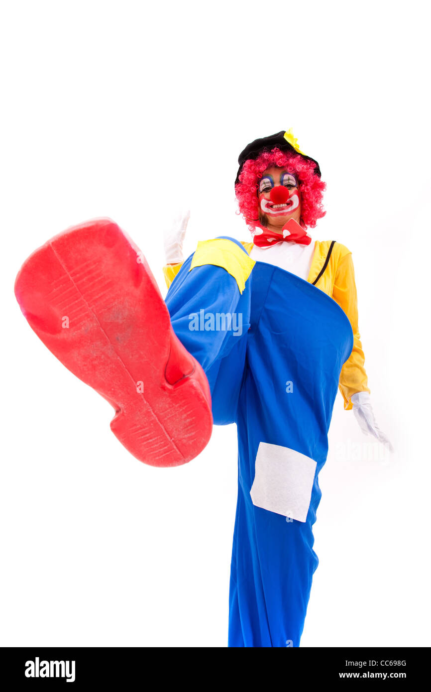 clown smashing something with his foot (isolated on white Stock Photo ...