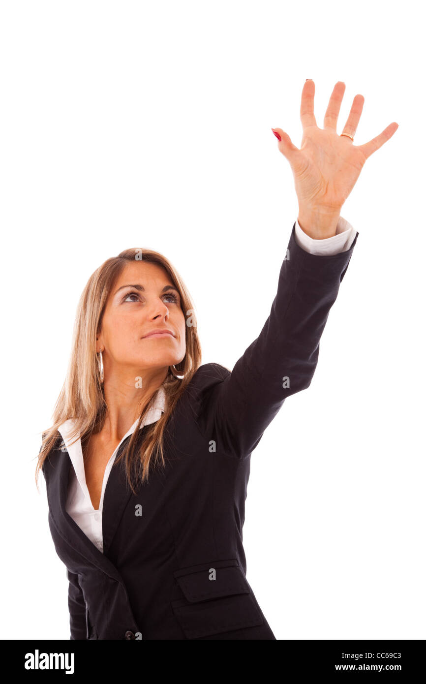 businesswoman trying to reach something with her hand Stock Photo - Alamy