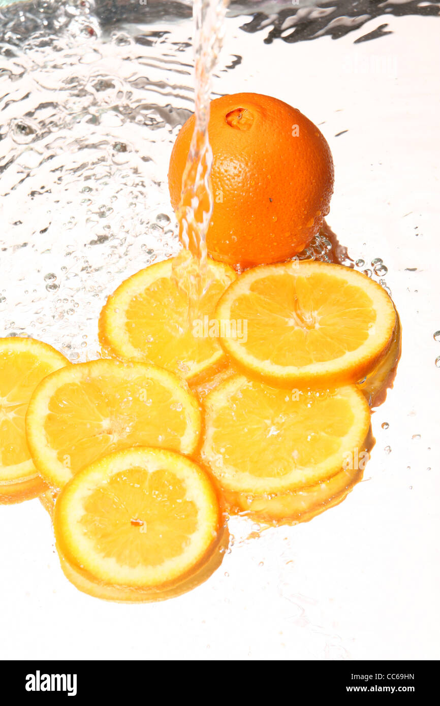 water splash and orange Stock Photo - Alamy