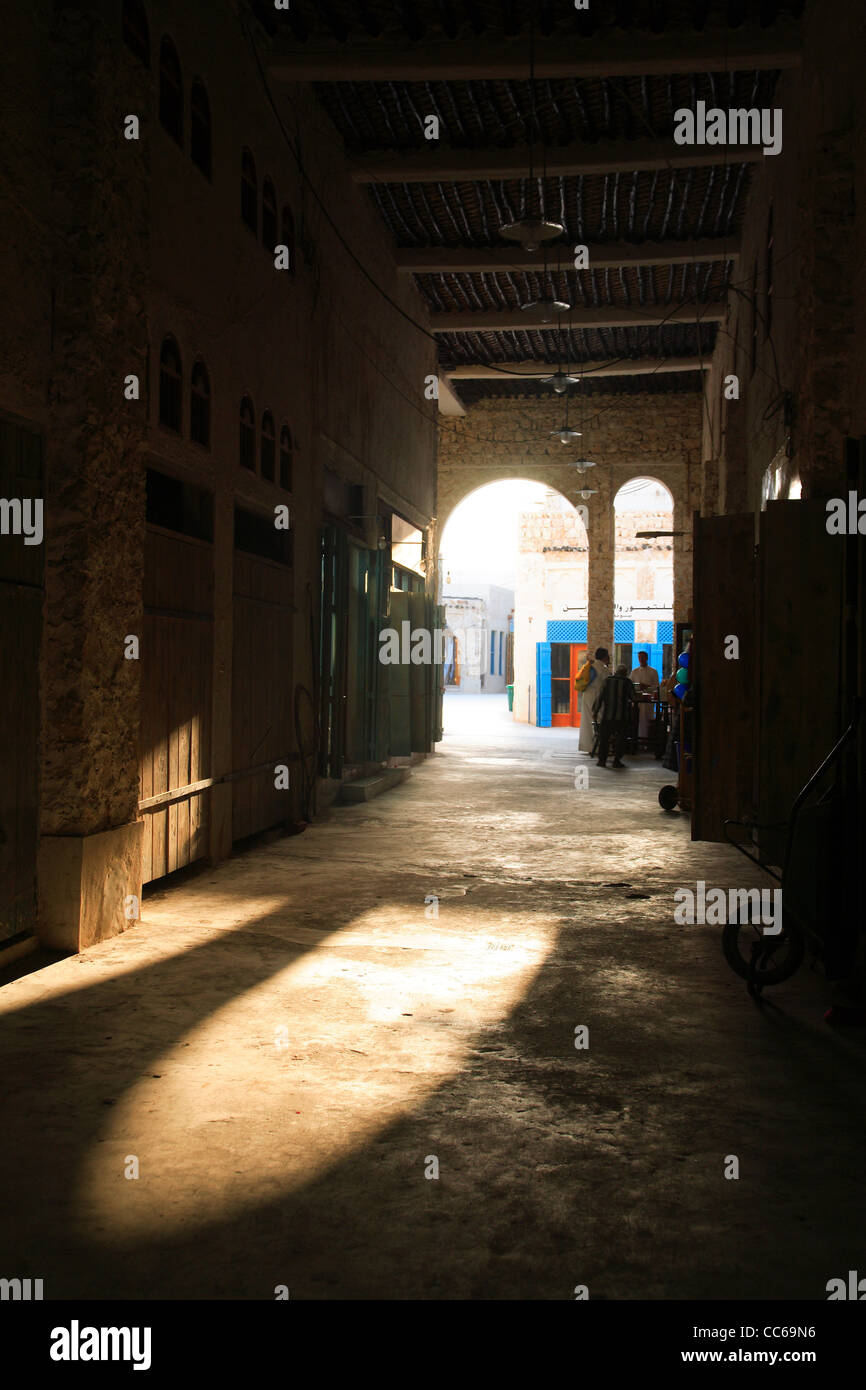 People walking through the covered streets in a Doha Souk (souq Stock ...