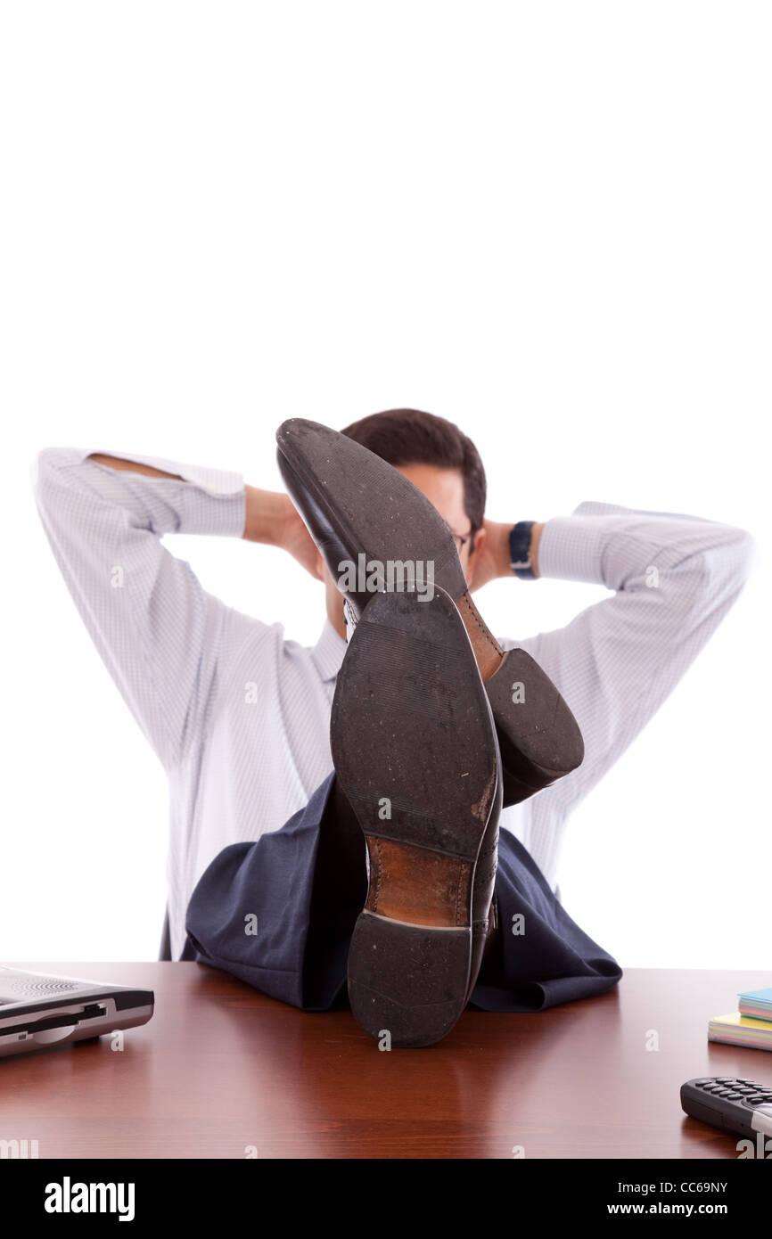 businessman relaxing at the office with his shoes on the desk (isolated ...
