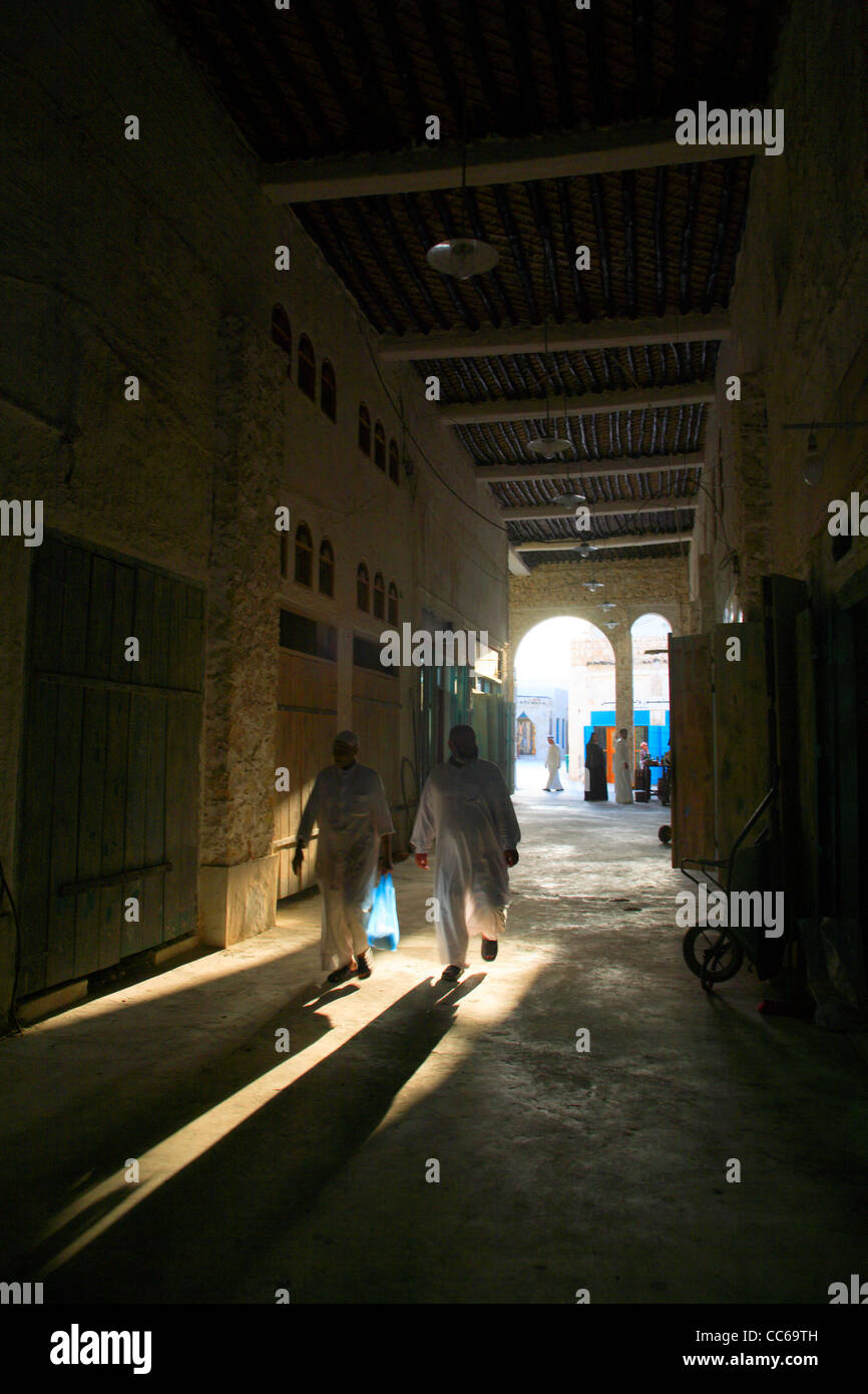 People walking through the covered streets in a Doha Souk (souq Stock ...