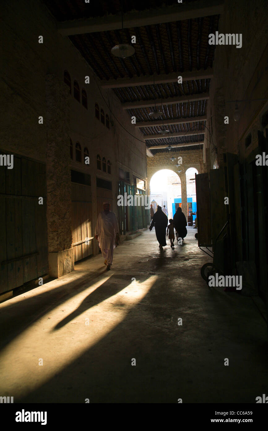 People walking through the covered streets in a Doha Souk (souq Stock ...