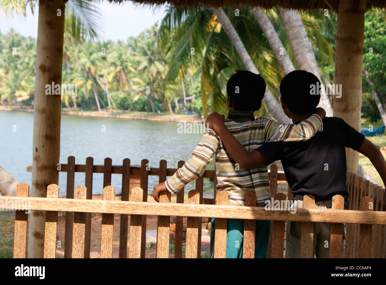 Child friendship.Two small Friends enjoying beautiful Kerala landscape ...