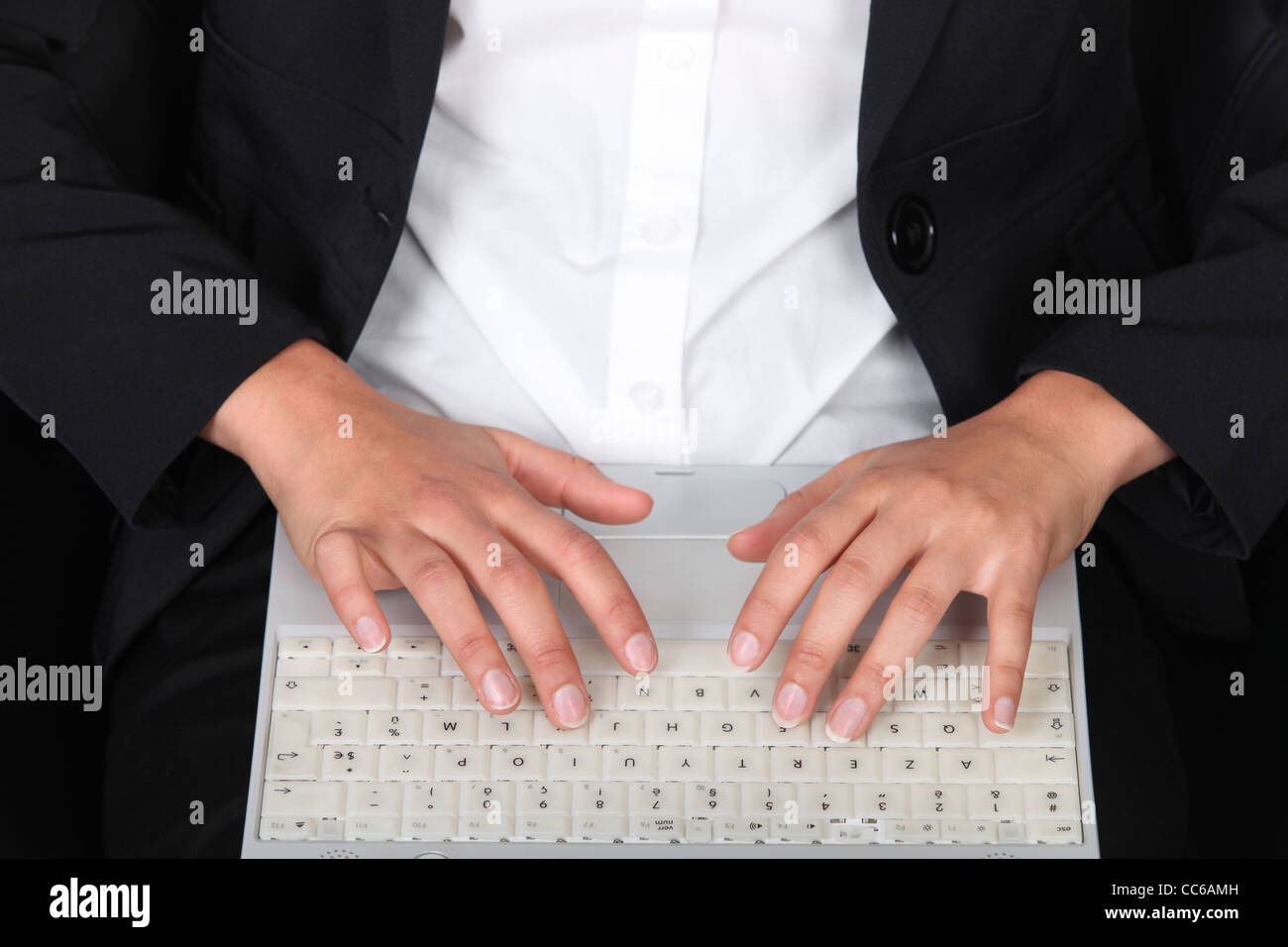 Woman typing on laptop keyboard Stock Photo - Alamy