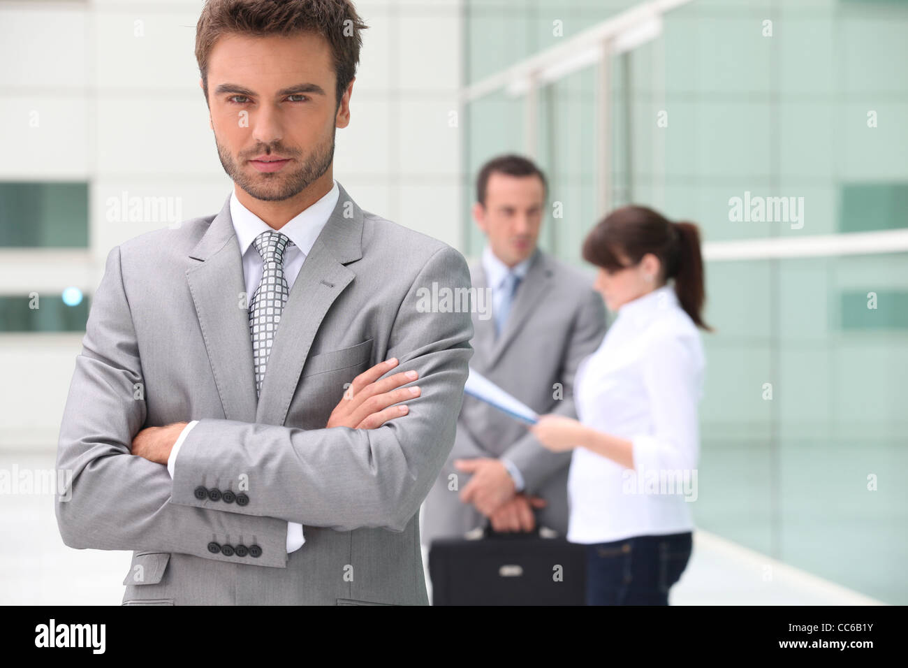 Serious executive outside office building Stock Photo - Alamy