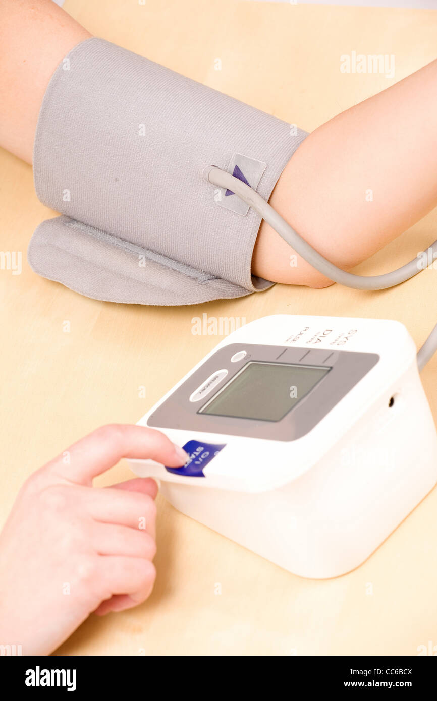 Checking blood pressure Stock Photo - Alamy