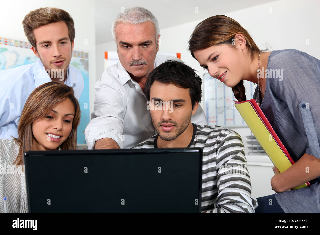 group of people watching a screen Stock Photo - Alamy
