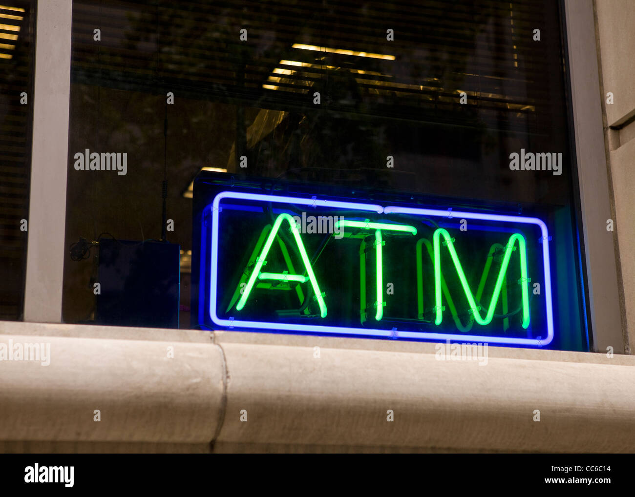 A neon ATM sign in window - USA Stock Photo - Alamy