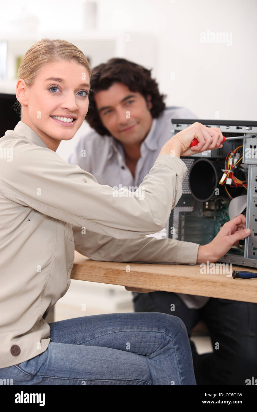 female technician repairing a computer Stock Photo - Alamy