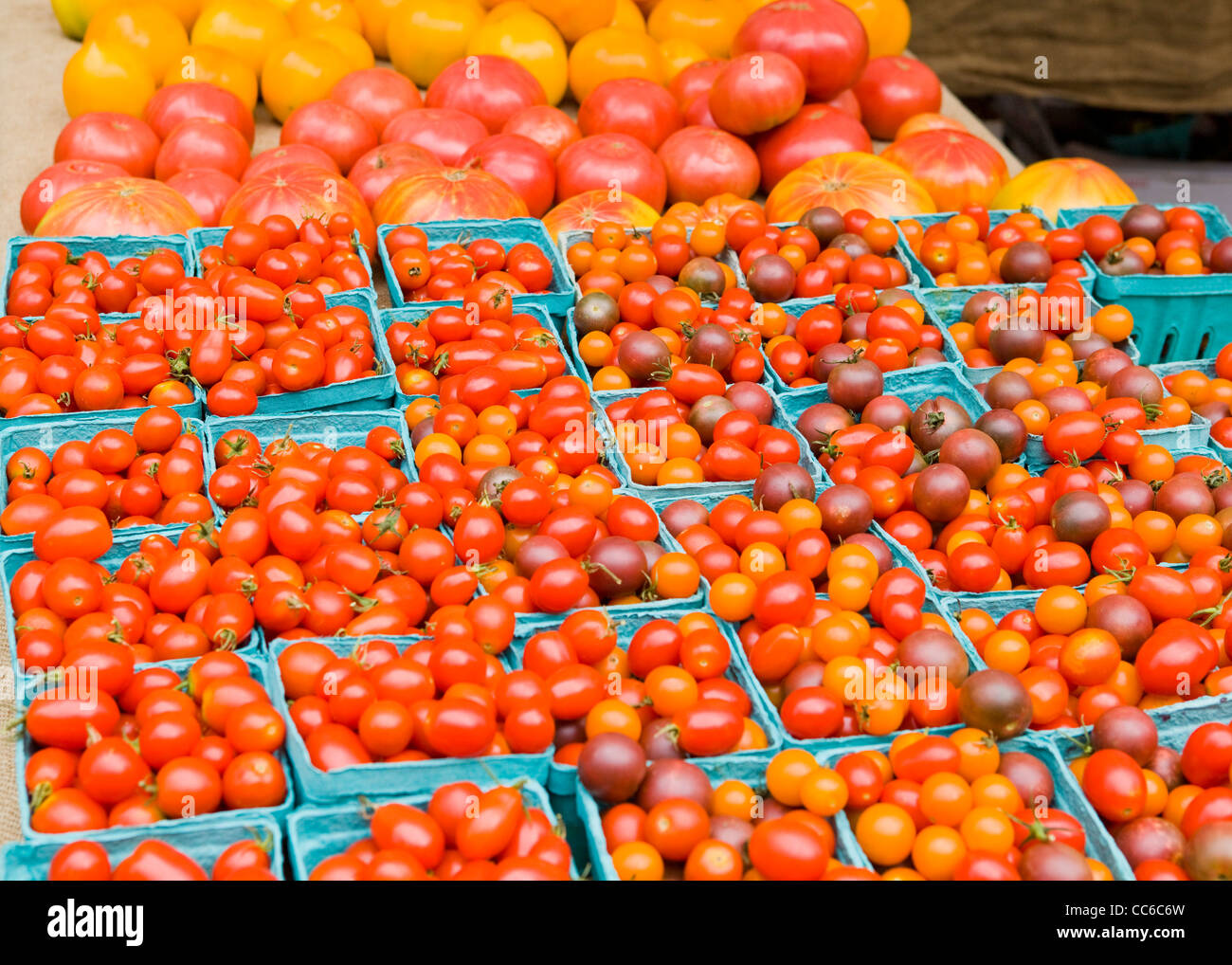 Organic cherry tomatoes in baskets Stock Photo - Alamy