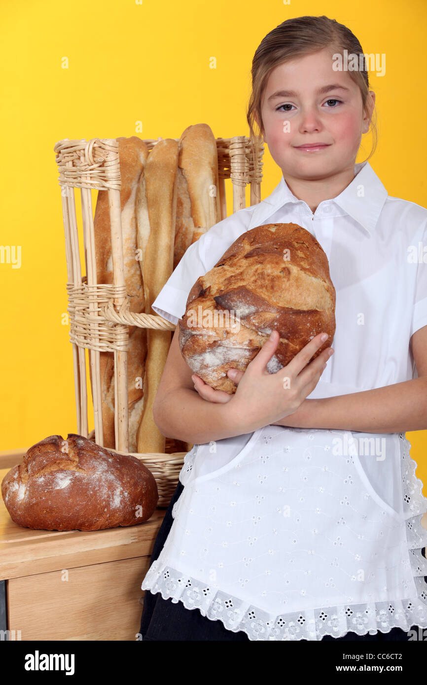 Young girl with fresh bread Stock Photo - Alamy