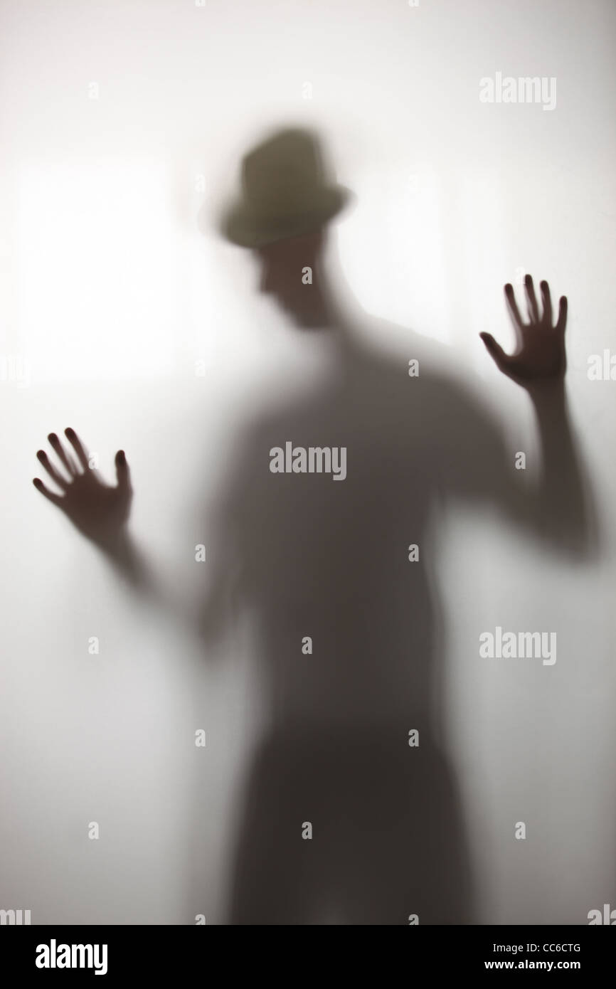 man standing behind a screen Stock Photo - Alamy