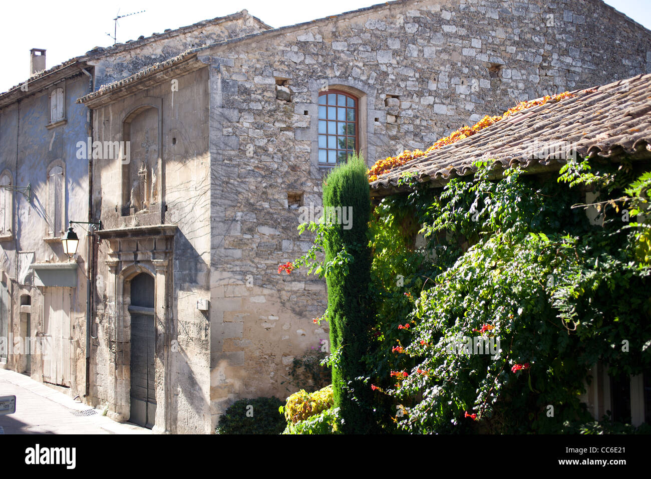 An old stone row house in the town of Menerbes, France Stock Photo - Alamy