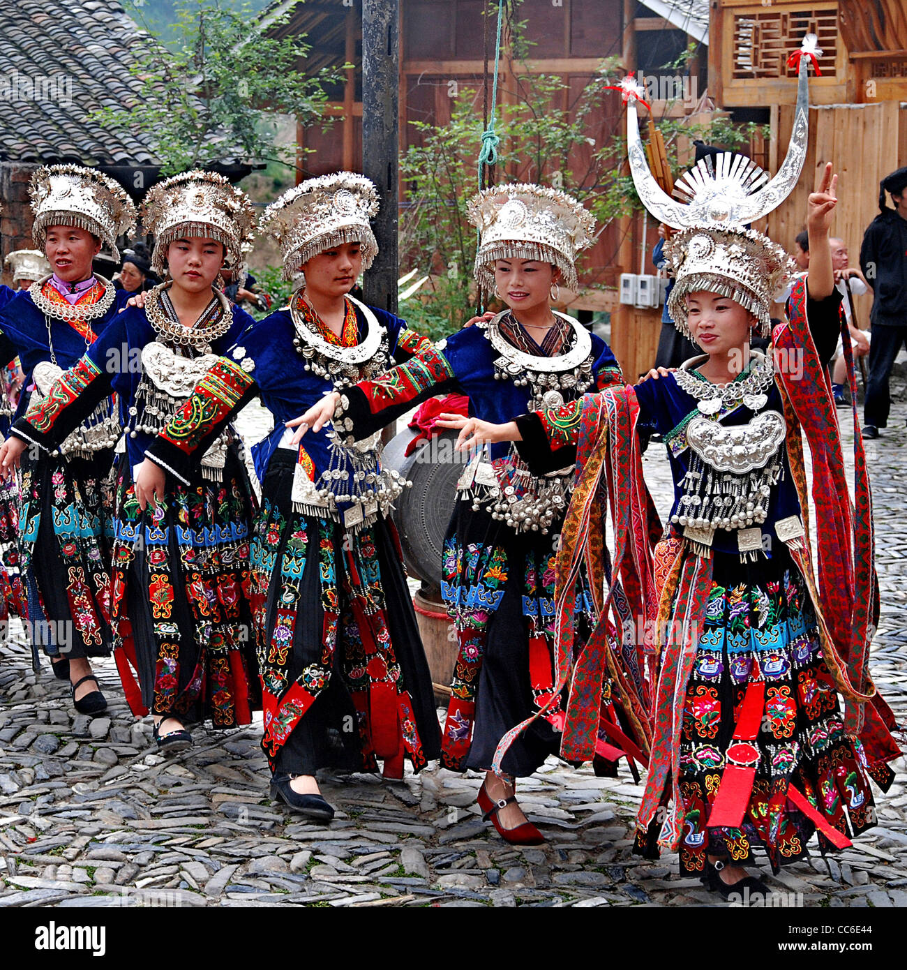 Miao women performing traditional dance, Nanhua Miao Village ...