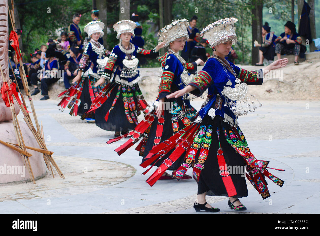 Miao women performing traditional dance, Nanhua Miao Village ...