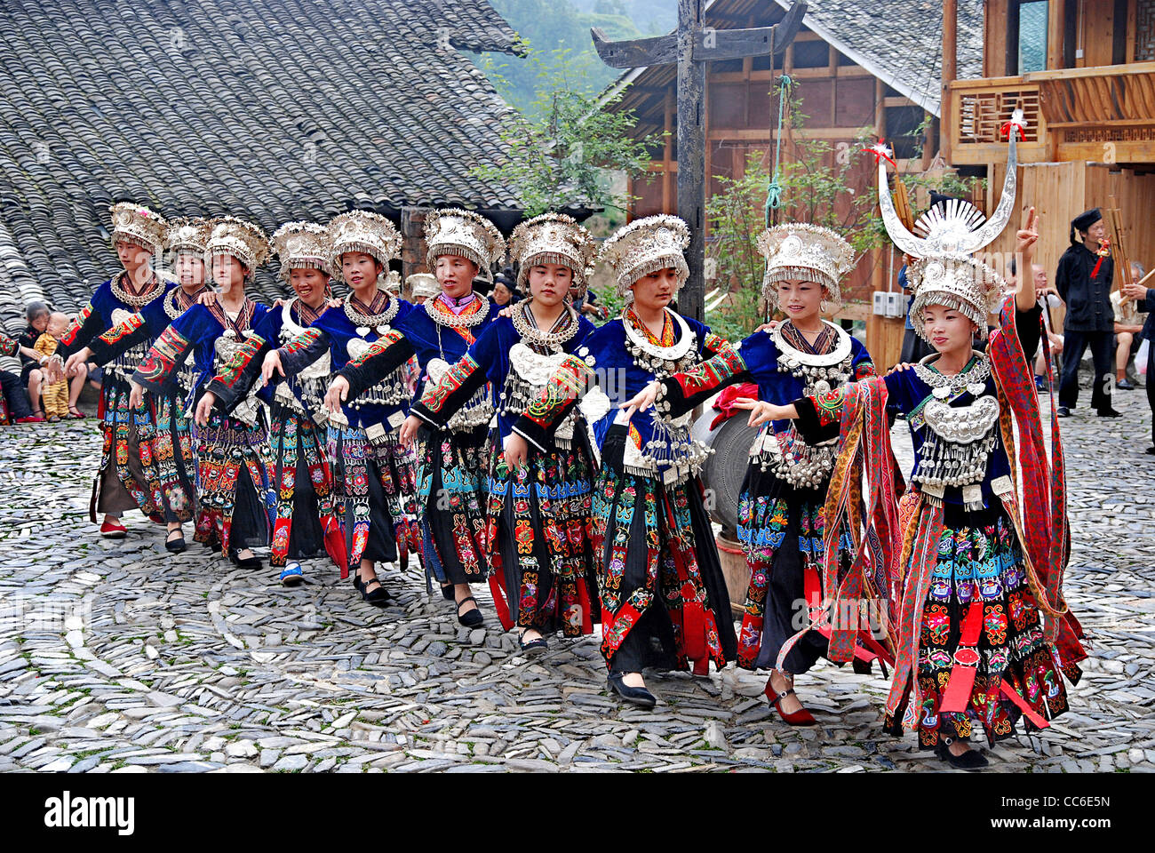 Miao women performing traditional dance, Nanhua Miao Village ...