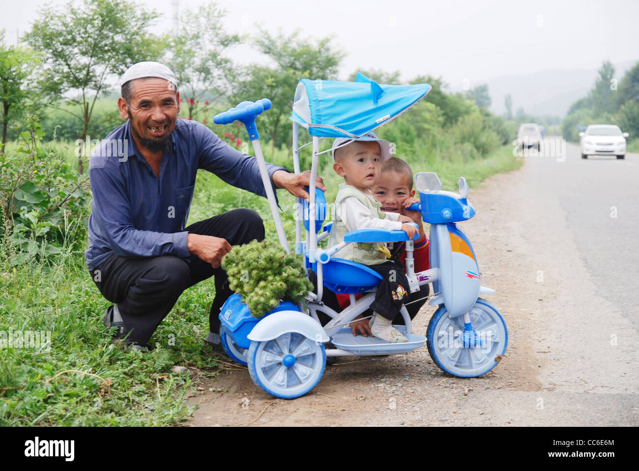 Elderly Hui man with his grandson, Lanzhou, Gansu , China Stock Photo ...