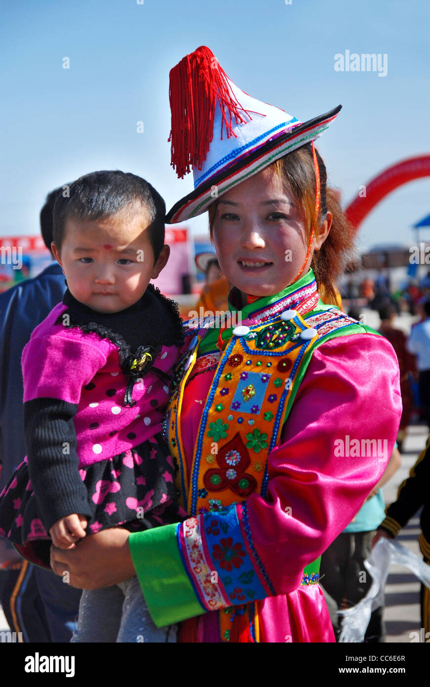 Yugur woman with her daughter wearing traditional costume Stock Photo ...