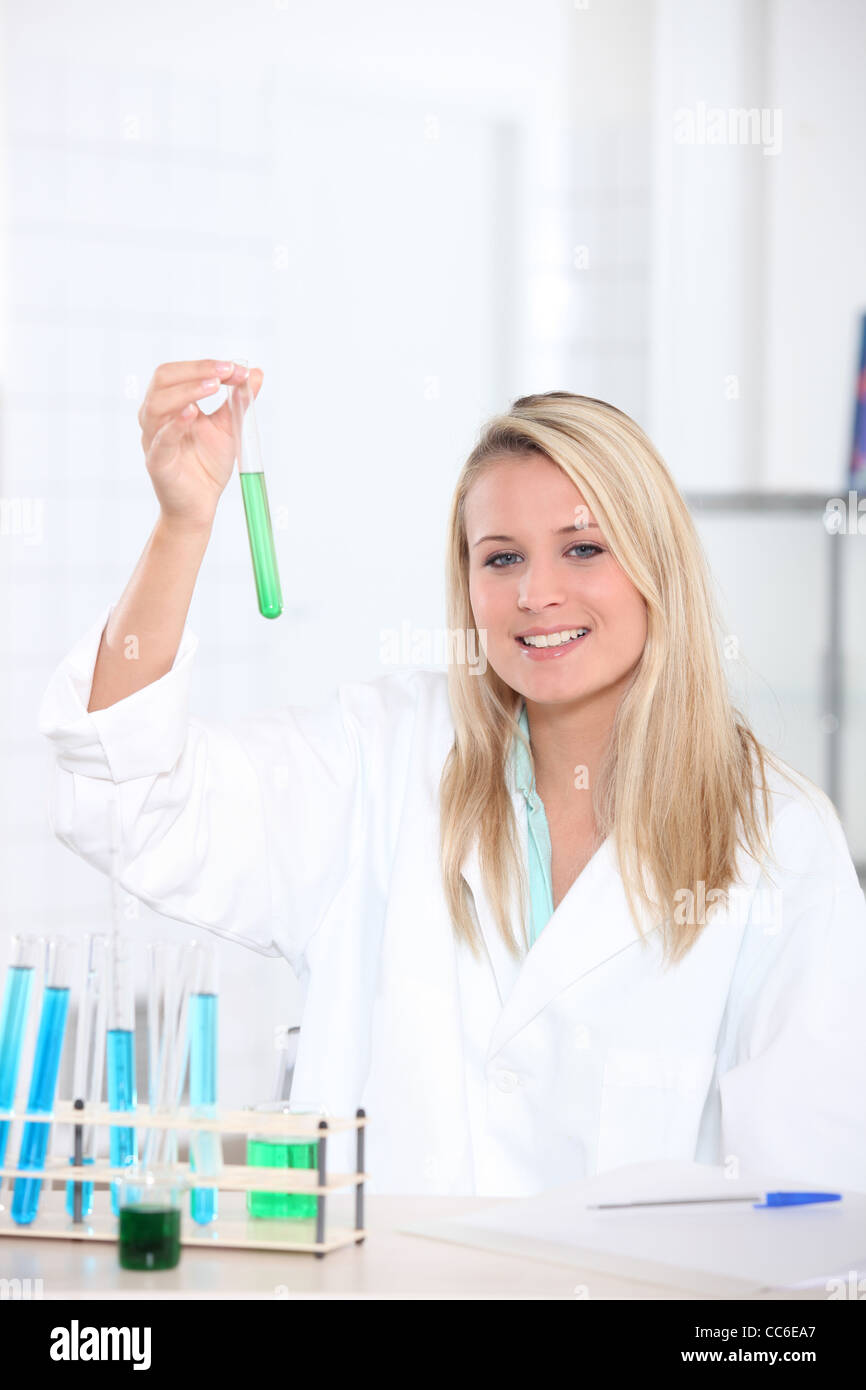 female biologist in laboratory holding test tube Stock Photo - Alamy