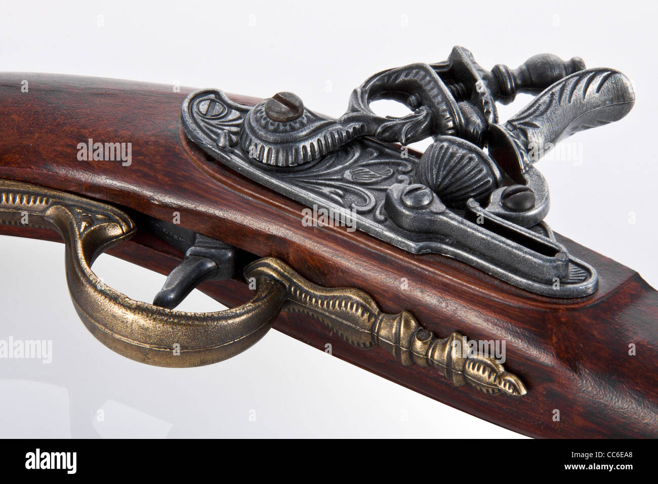 Close up trigger and firing mechanism of an ancient flint pistol ...