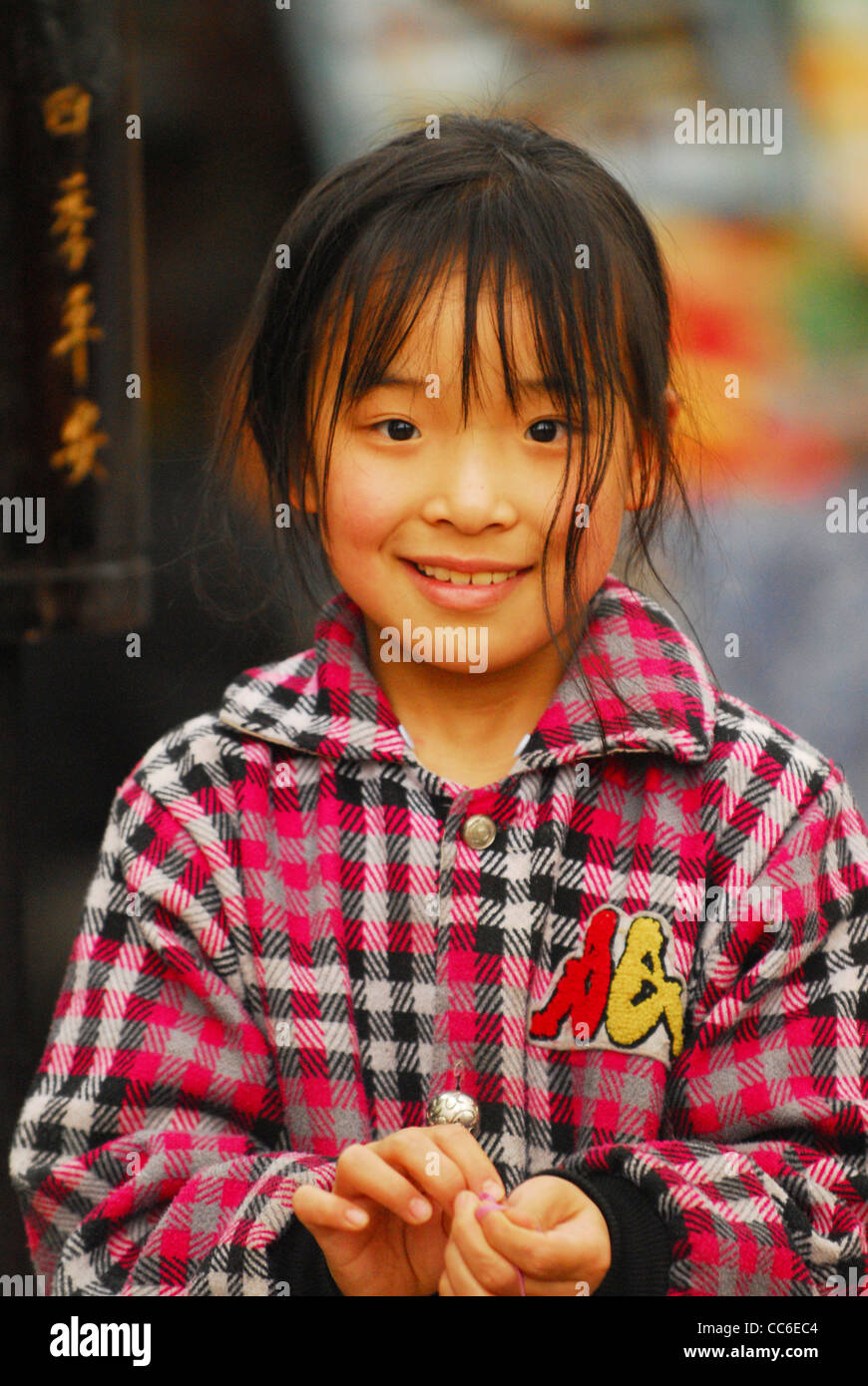 Girl in fake clothes smiling, Pingle Ancient Town, Chengdu, Sichuan ...