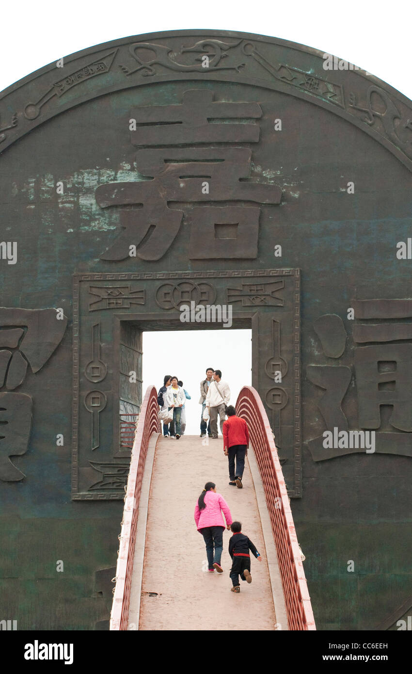 Bridge through the giant Jia Jing Tong Bao statue, Huize Park, Qujing ...