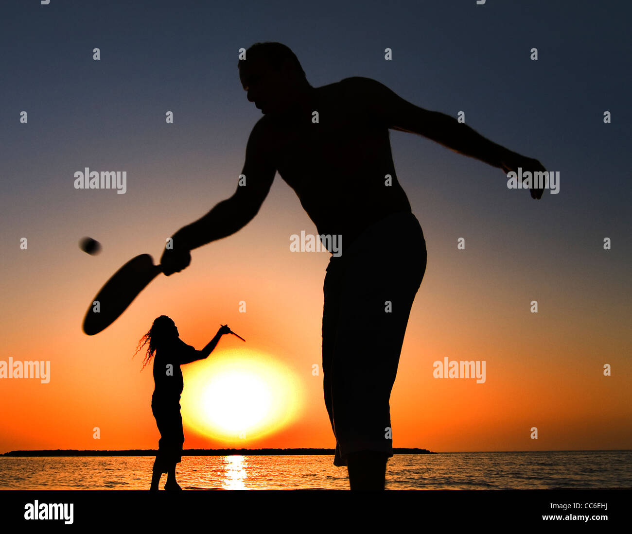 Israelis playing Matkot ( beach paddle ball ) on the beach in Tel-Aviv ...