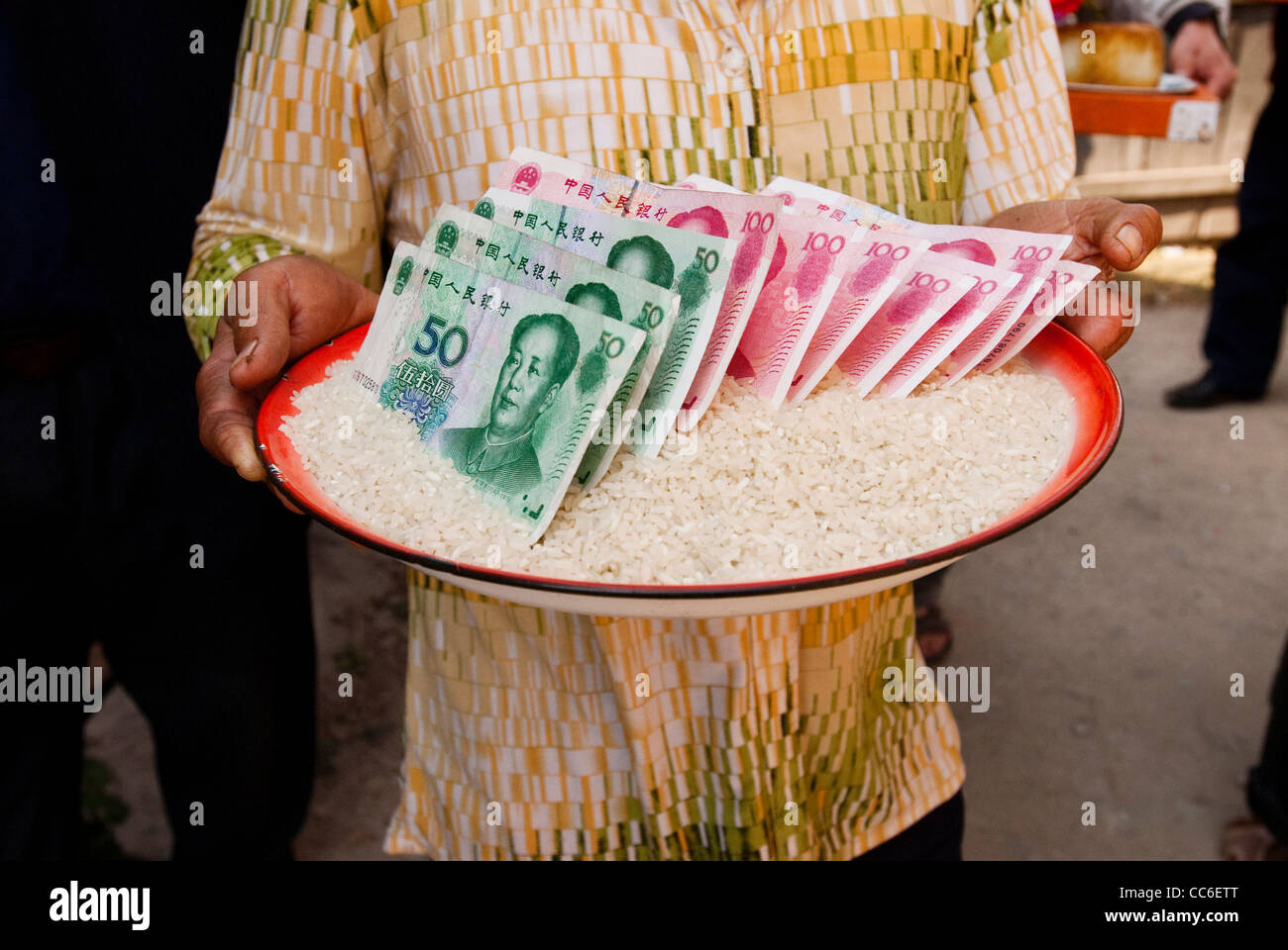 Woman offer hell bank notes to ancestors, Yangbi, Dali, Yunnan , China ...