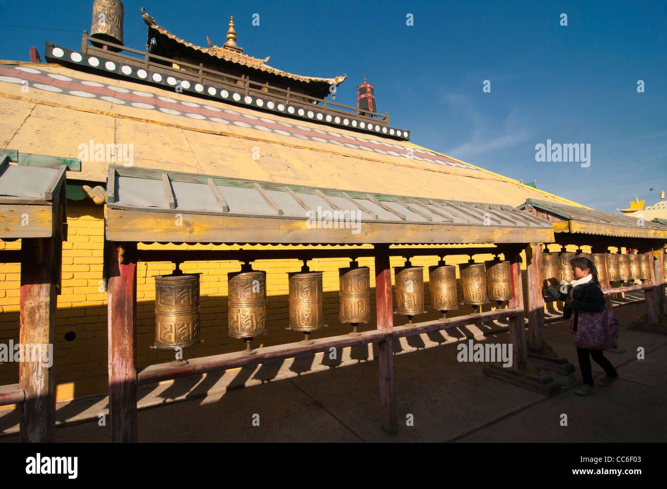 pilgrim spinning prayer wheels at Gandan Monastery in Ulan Baatar ...